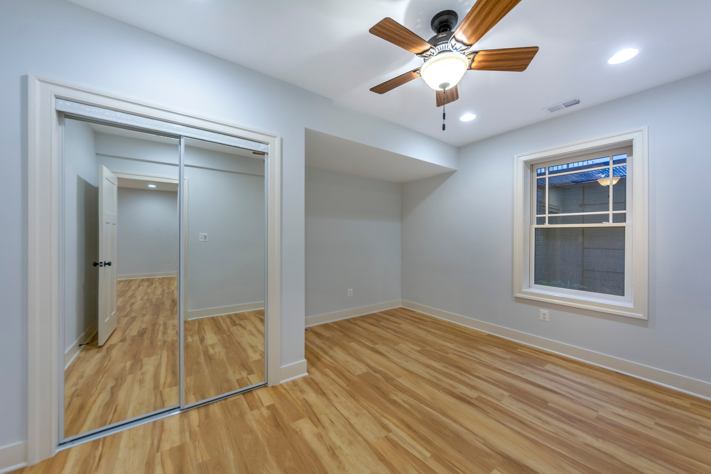 Basement Renovation - Hidden Lighting Features, Double Glass Doors