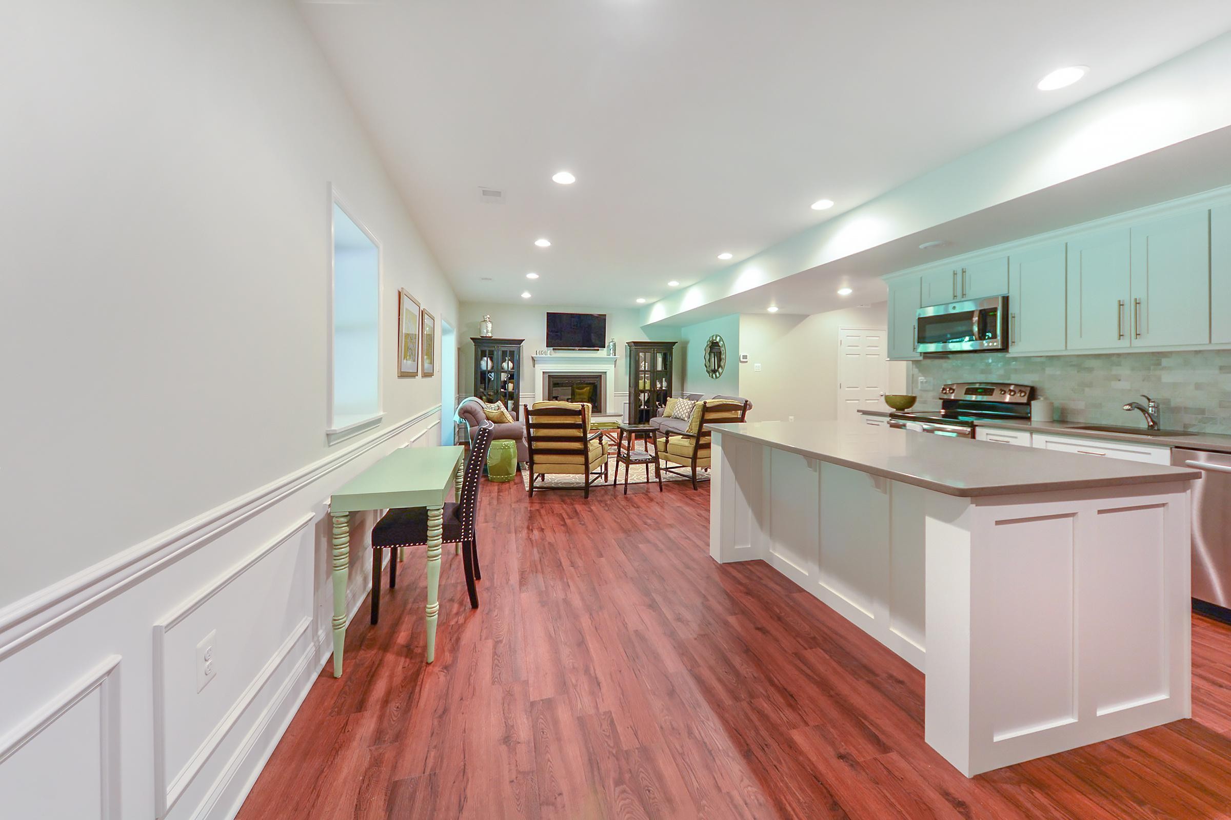 Basement Remodeling - Spacious Family Room with Fireplace and Kitchenette