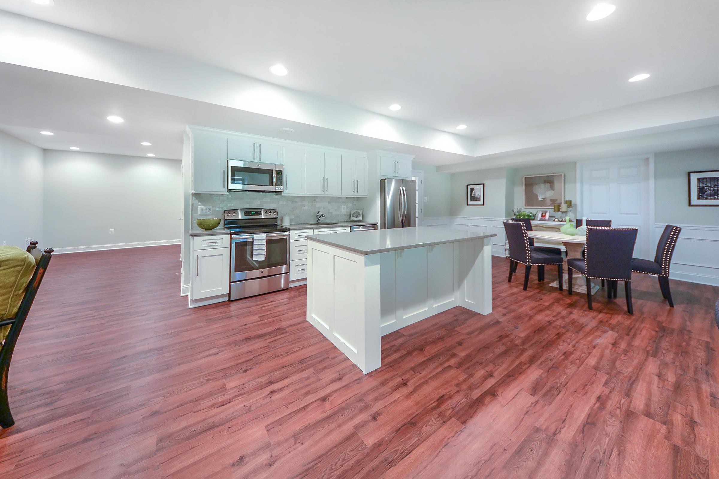 Basement Remodeling - Spacious Family Room with Fireplace and Kitchenette